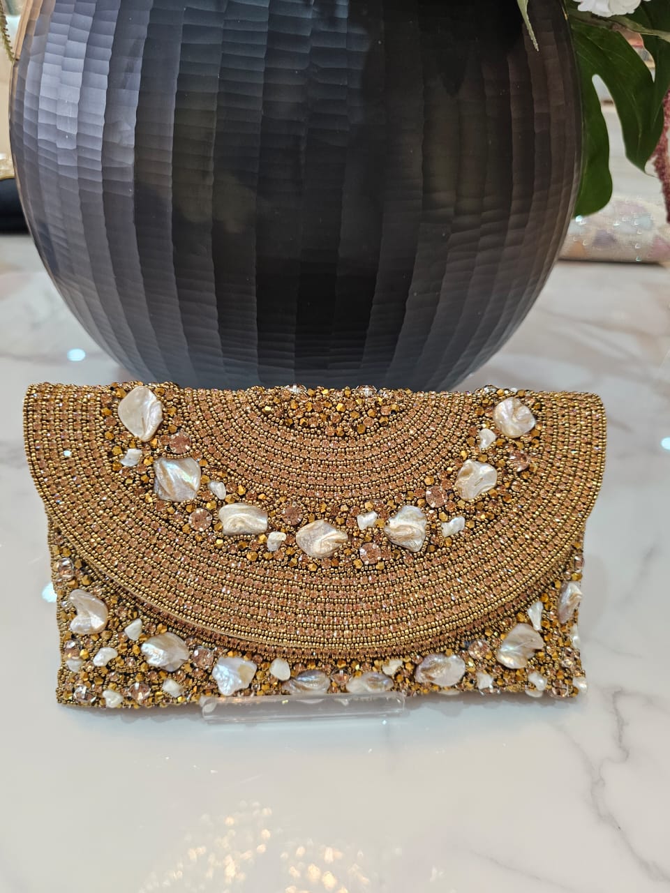 Bronze pouch with shell and bronze stone and moti work – Nikhat ...