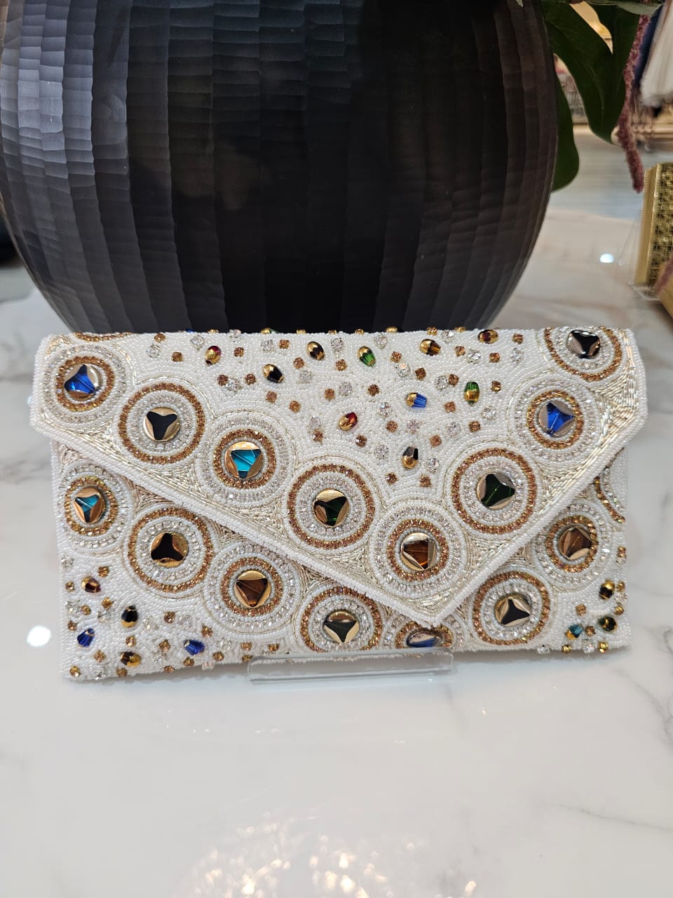 White moti pouch with silver and bronze stone and colouring beads ...